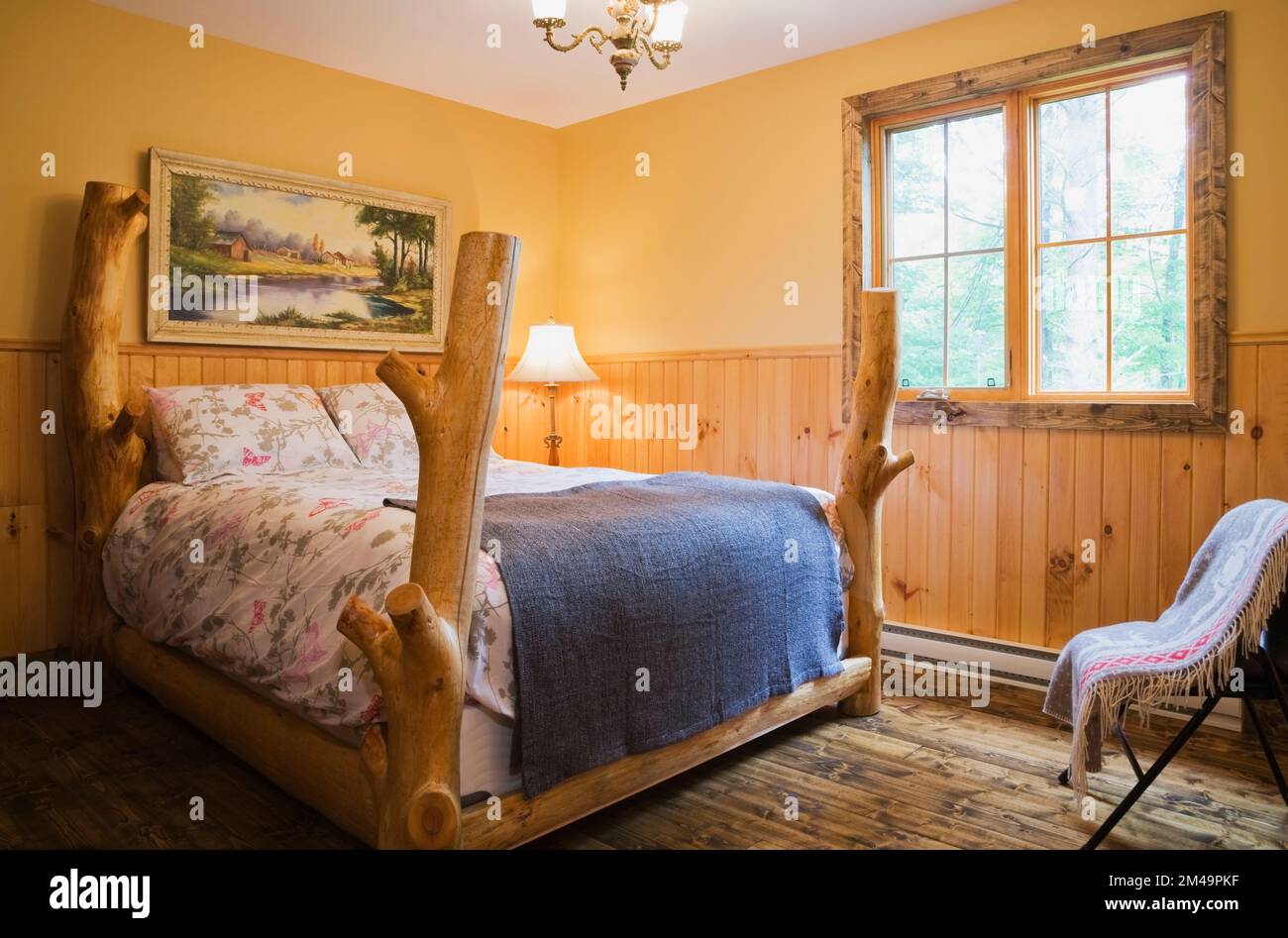 Rustic four poster bed in upstairs guest bedroom with nuanced brown ...