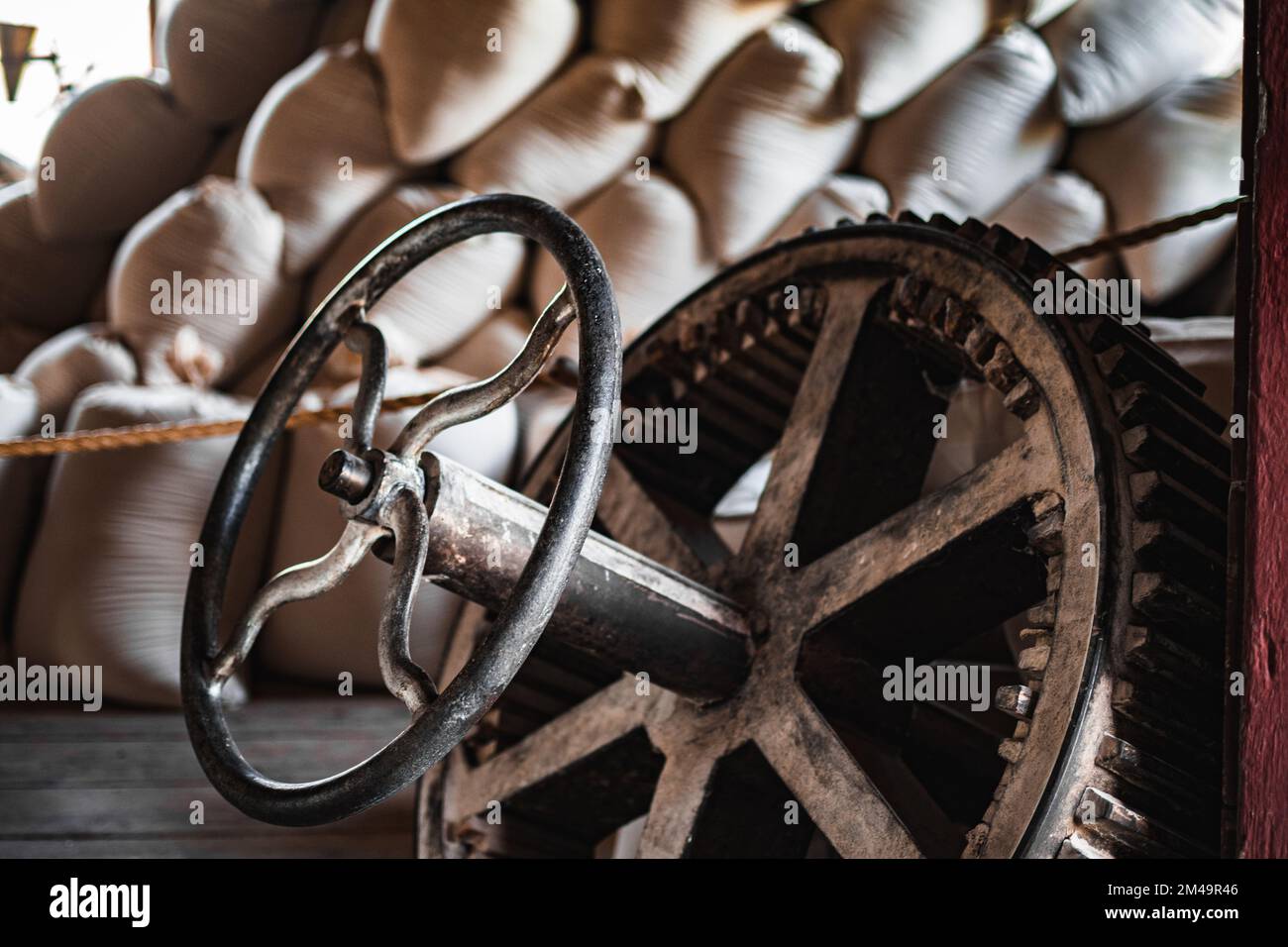 A closeup of the wheel's old and rusted metal parts with the background ...