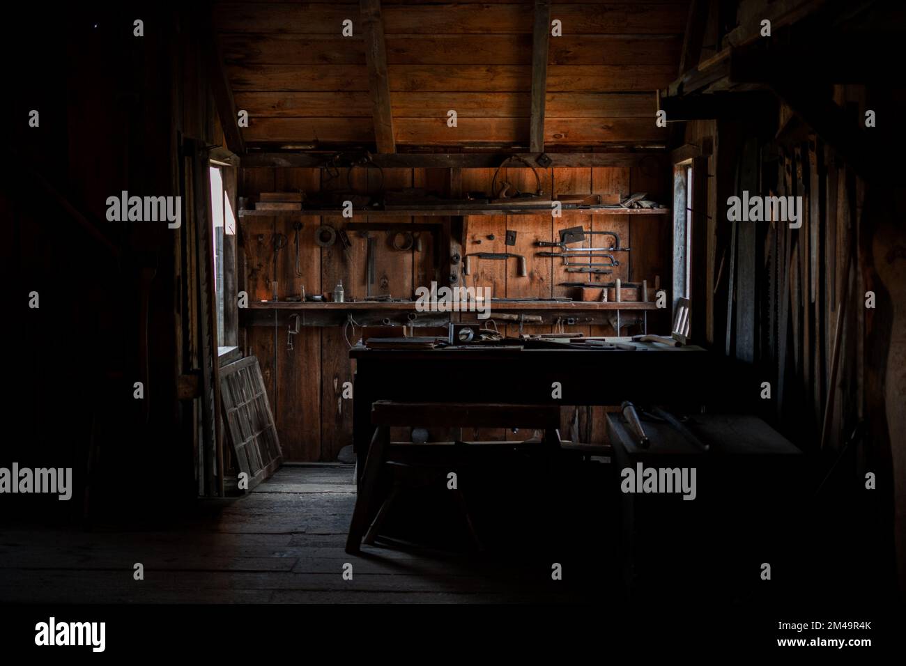 The old-fashioned metal parts and mechanisms in the wooden room Stock ...