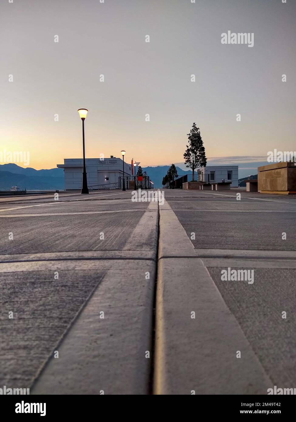 A beautiful view of a walkway lined with street lights Stock Photo - Alamy