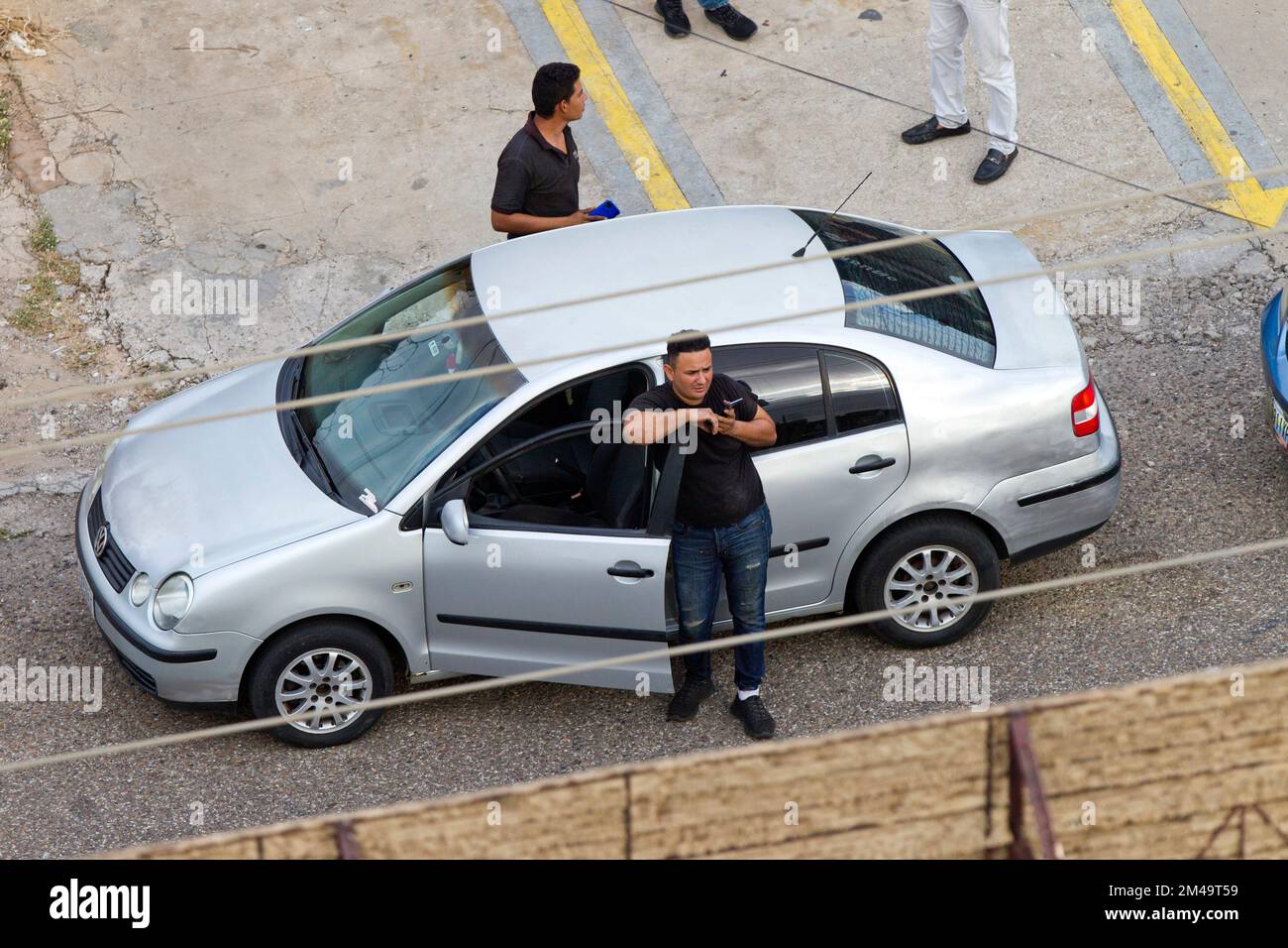 December 19, 2022, Maracaibo, Venezuelan pushes his car without ...