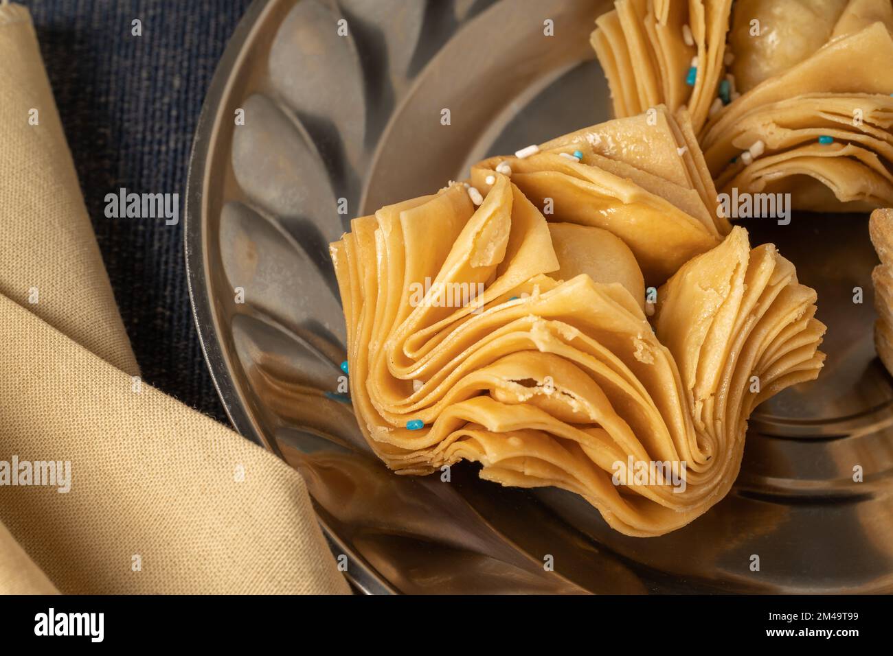 Close up of fried pastries stuffed with sweet potato or quince. Typical ...