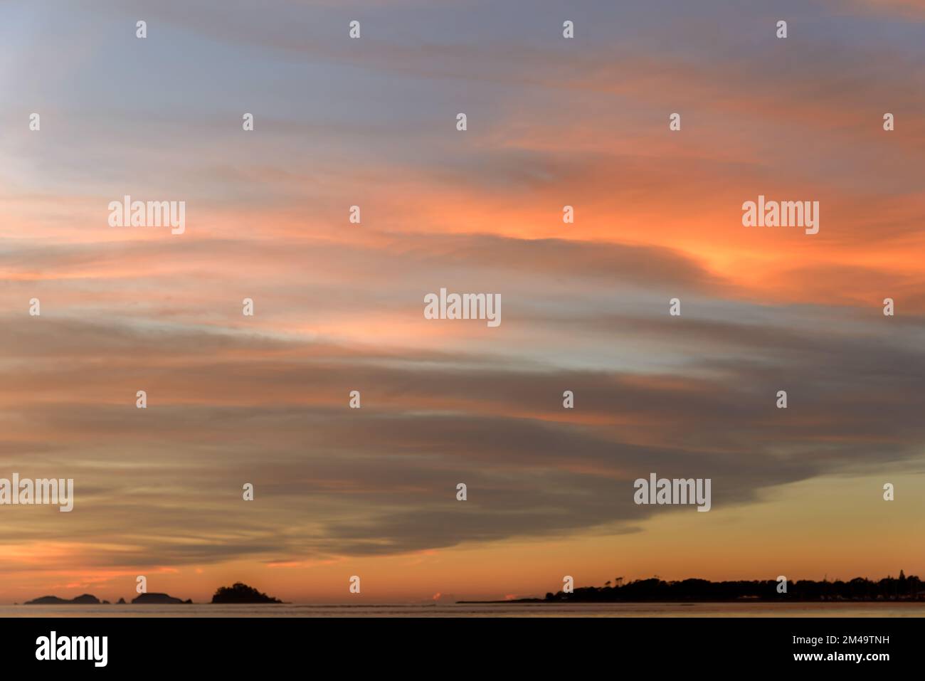Beautiful coloured sunrise with the clouds catching the colours as they ...