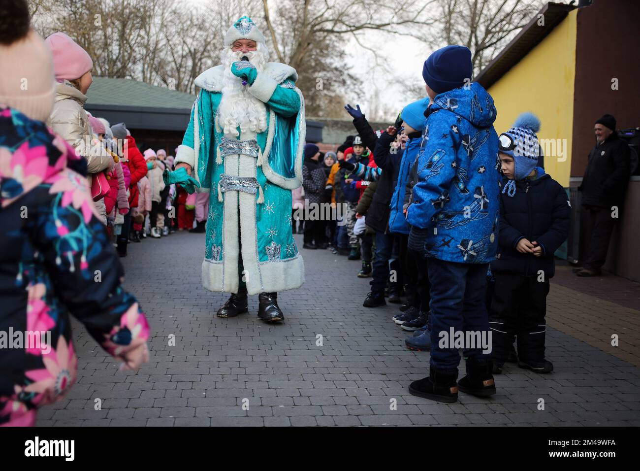 An animator dressed as St. Nicholas interacts with the children on St ...