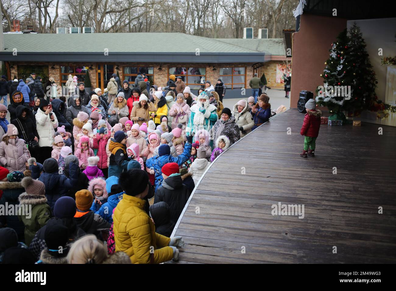 An animator dressed as St. Nicholas interacts with the children on St ...