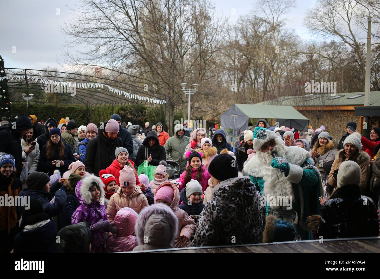 An animator dressed as St. Nicholas interacts with the children on St ...