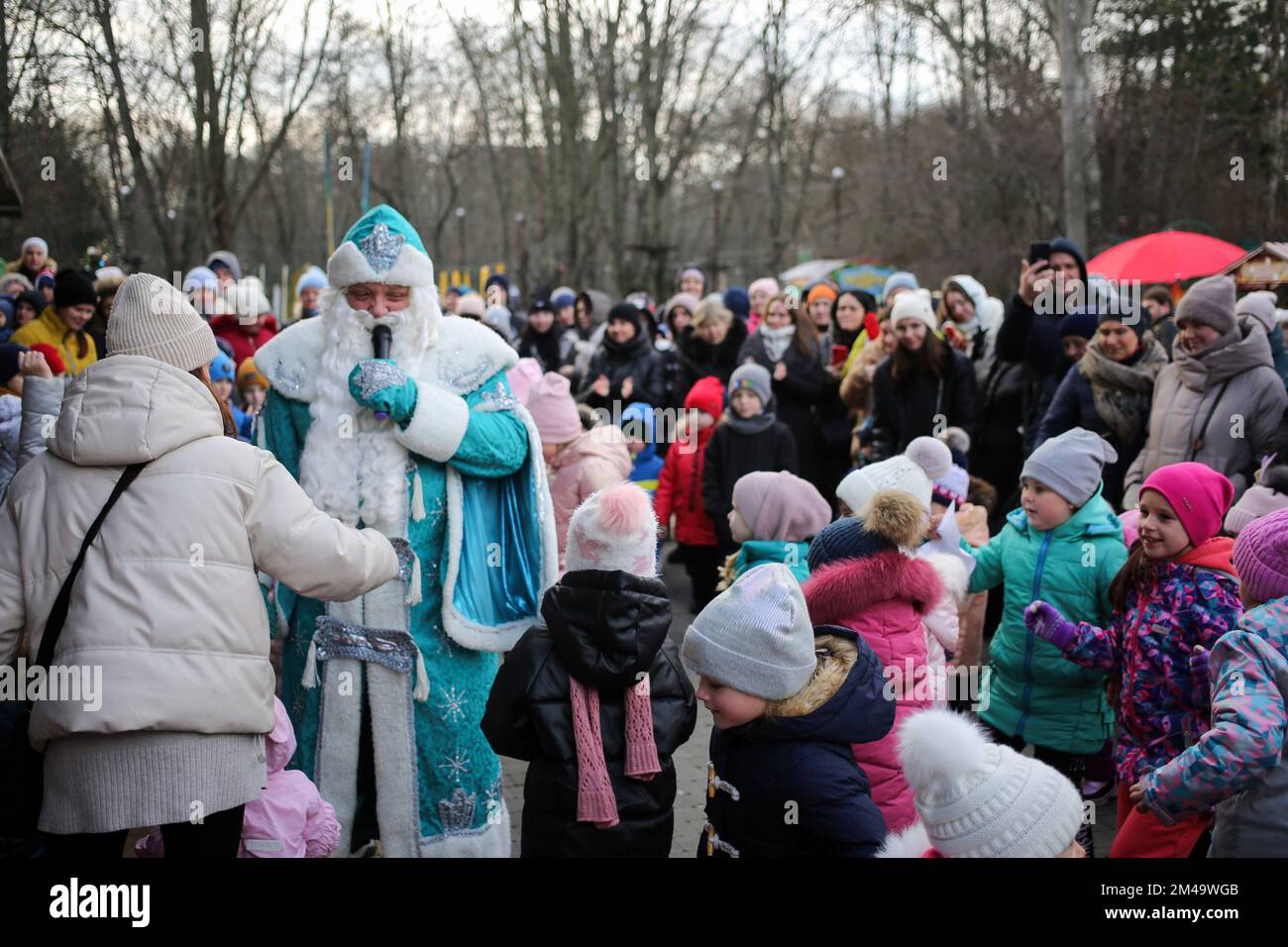 An animator dressed as St. Nicholas interacts with the children on St ...