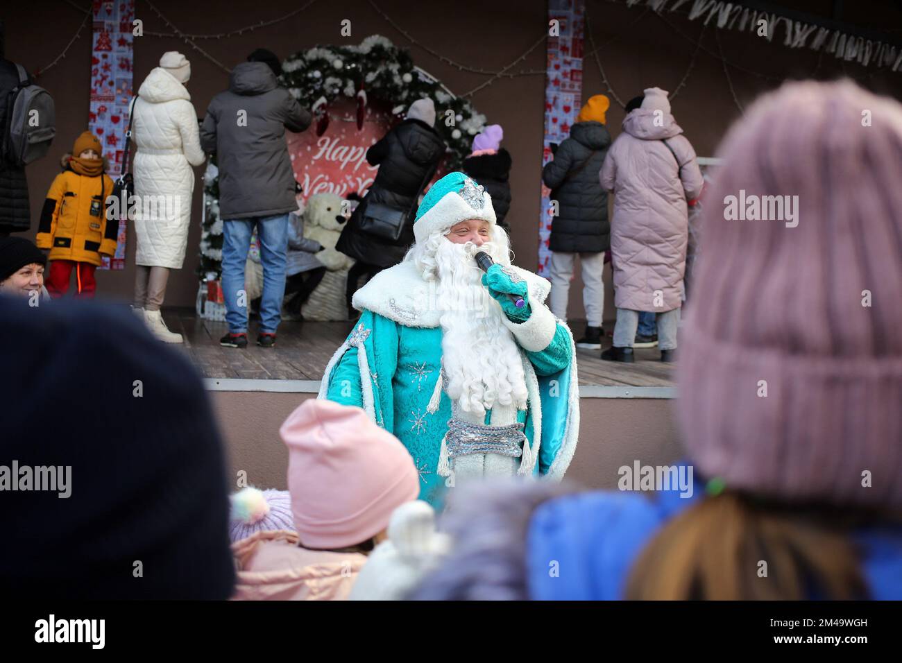 An animator dressed as St. Nicholas interacts with the children on St ...