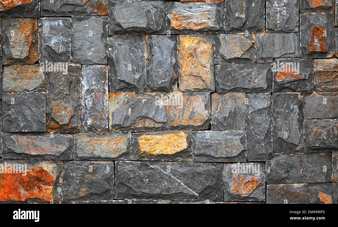 A closeup shot of a stone wall in a random pattern Stock Photo - Alamy