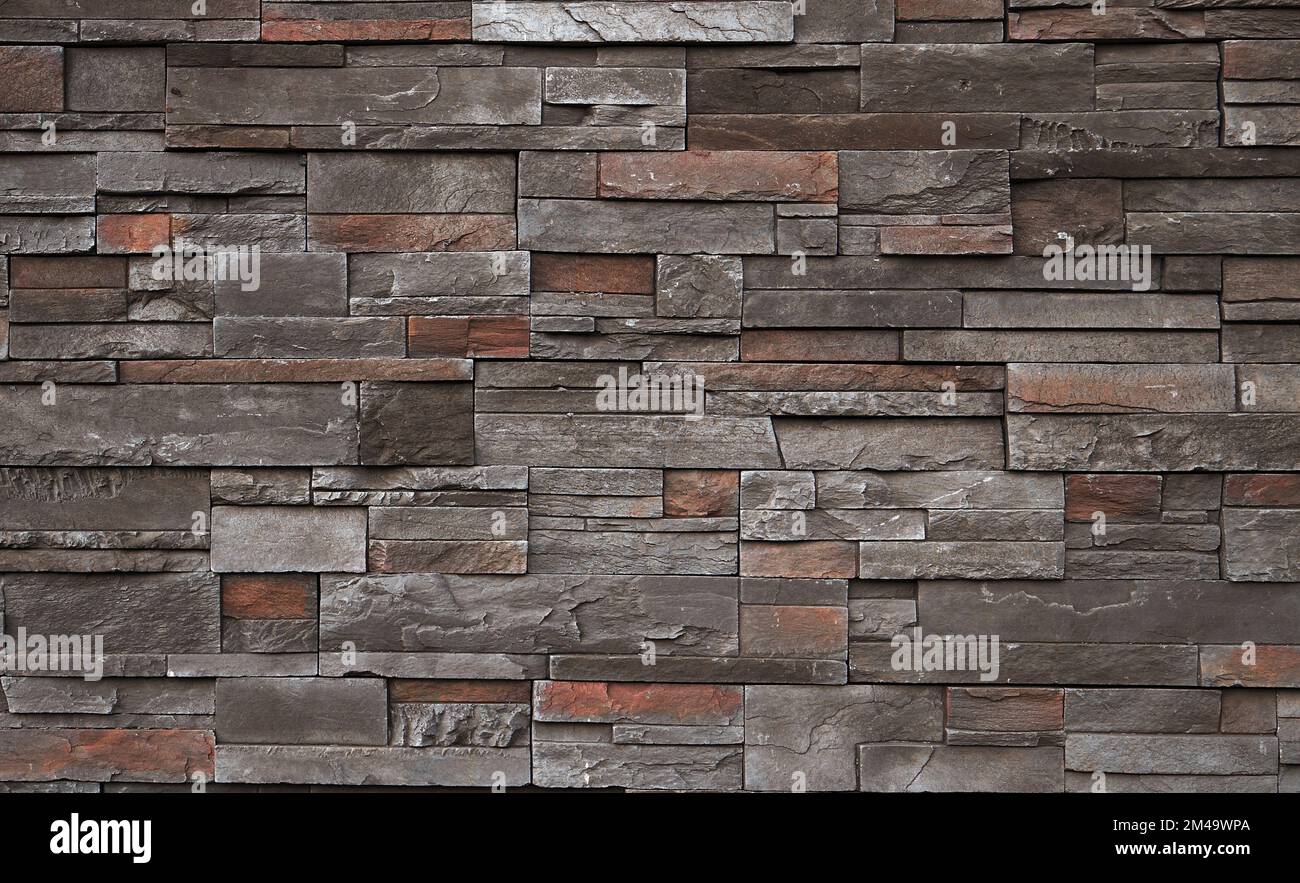 A closeup shot of a brick wall in a random pattern Stock Photo - Alamy