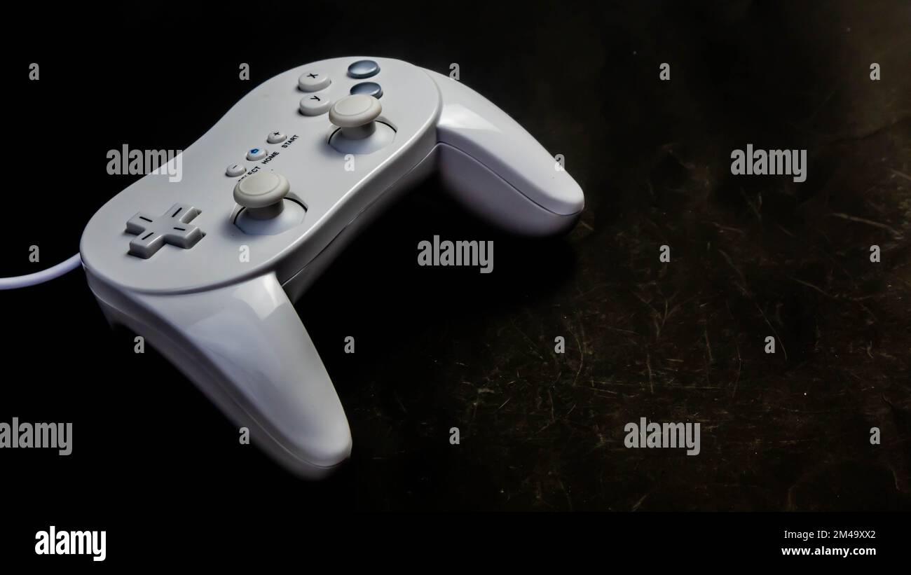 white joystick isolated on black background Stock Photo - Alamy