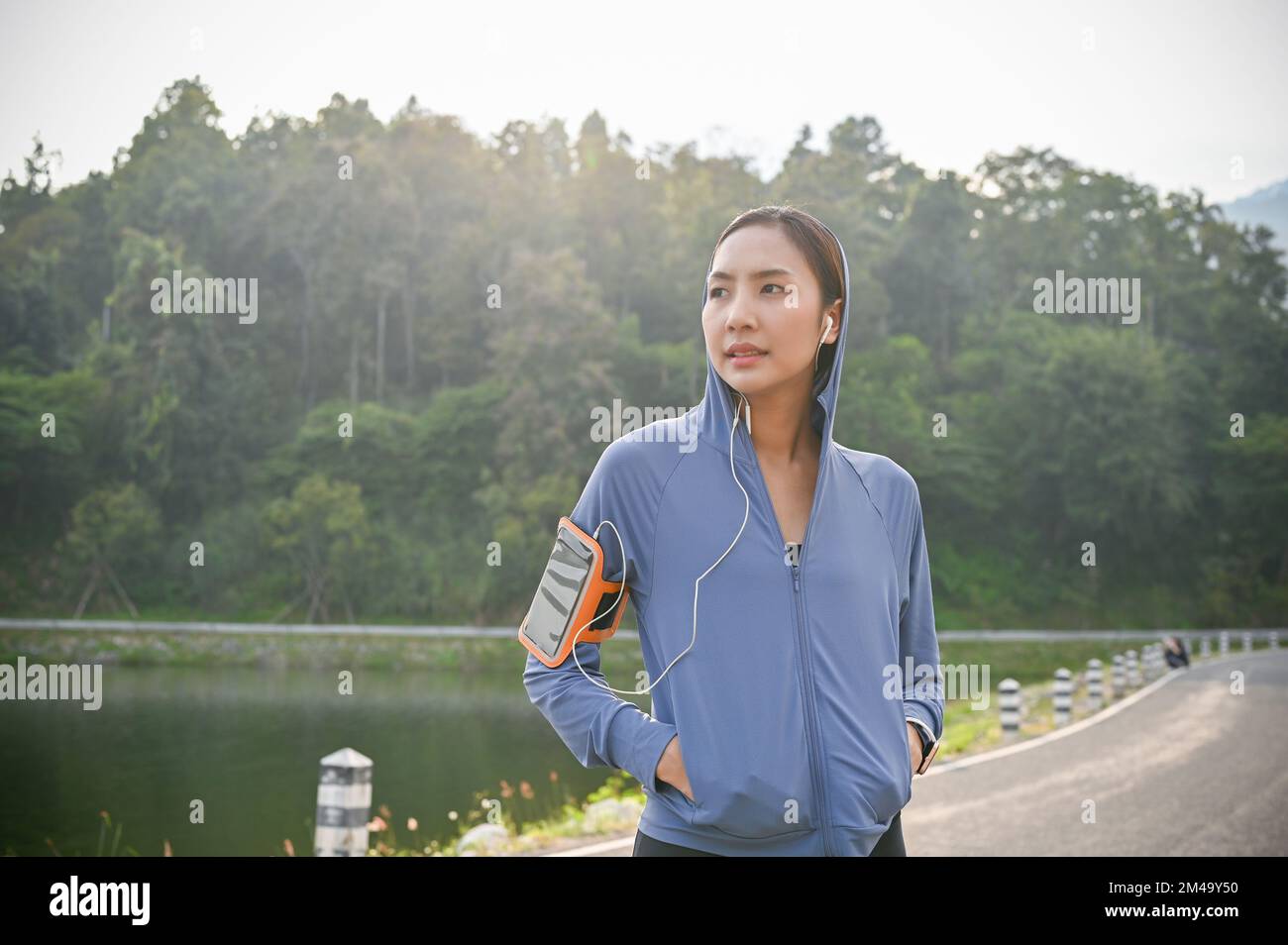Asian female runner rest hi-res stock photography and images - Alamy