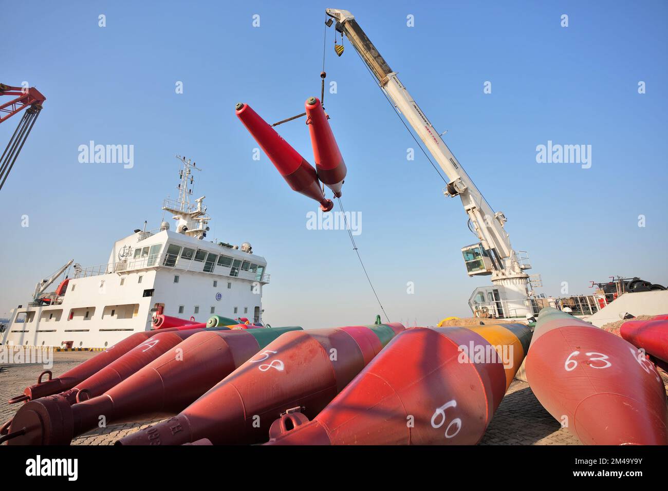 WEIFANG, CHINA - DECEMBER 19, 2022 - Cranes load the ice age ...
