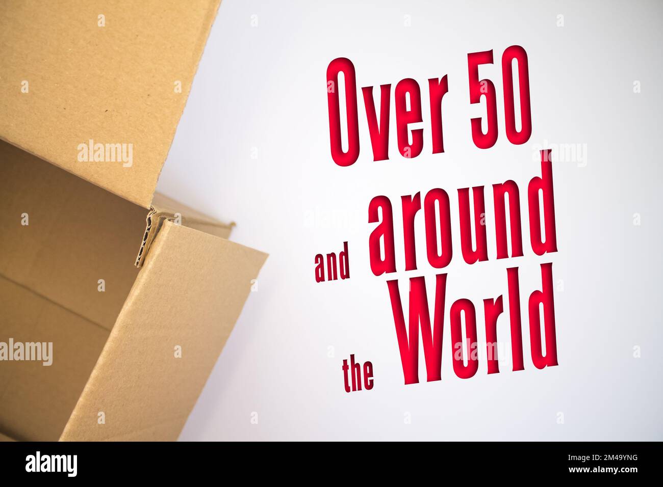Over 50 and around the world word with cardboard box. Brown folded card ...