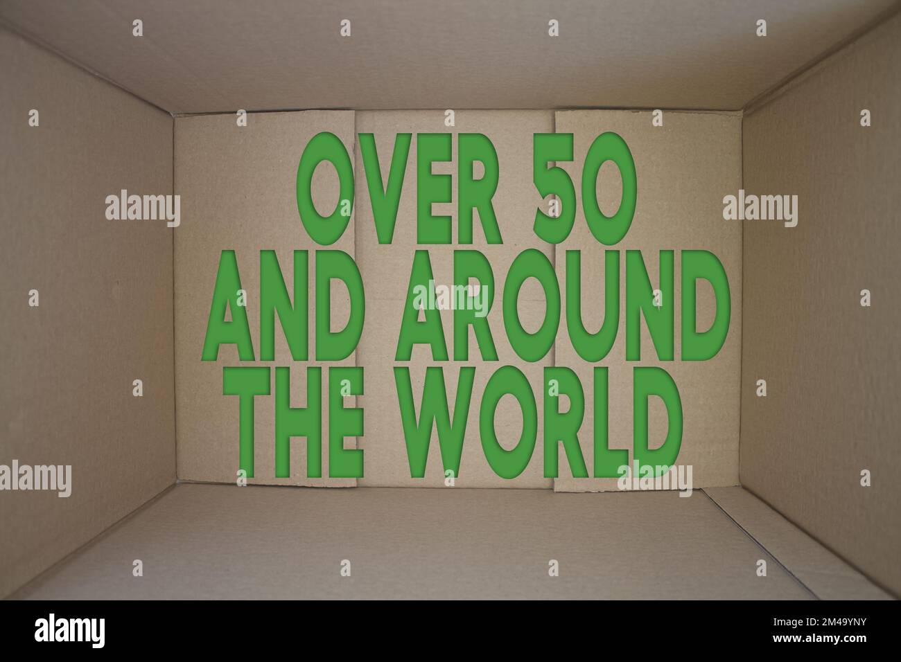 Over 50 and around the world word with cardboard box. Brown folded card ...
