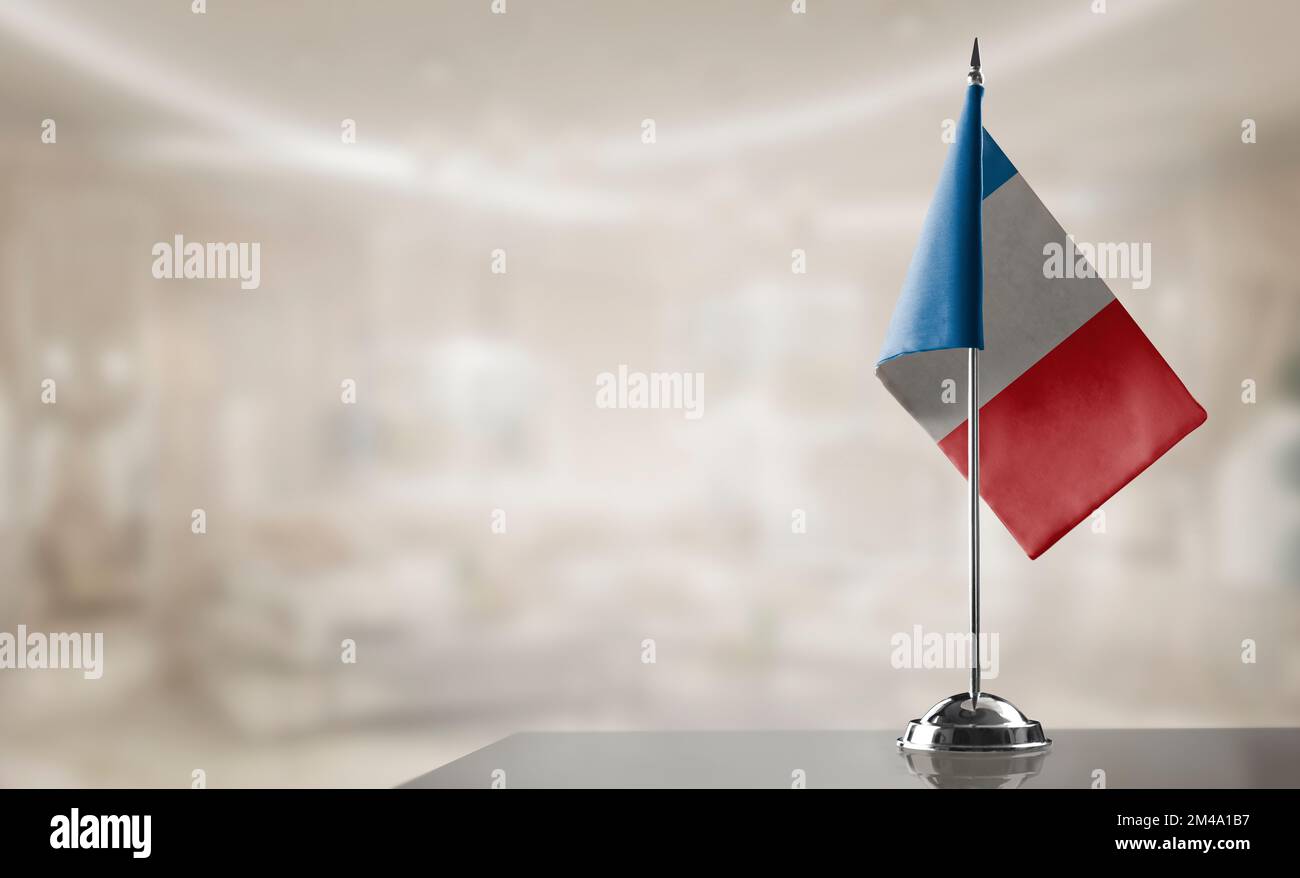 A small France flag on an abstract blurry background Stock Photo - Alamy