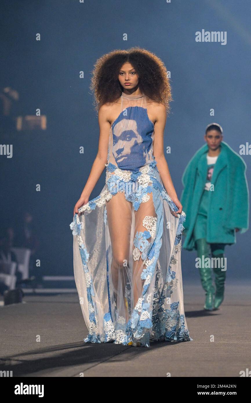 A model presents a creation during Qatar Fashion United event, where ...