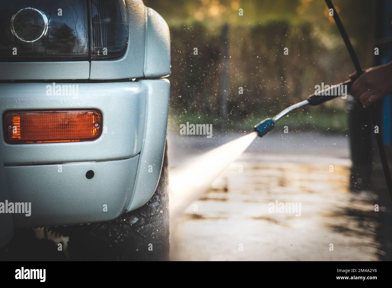 Close-up of a jet of water spraying around a high-pressure washing ...