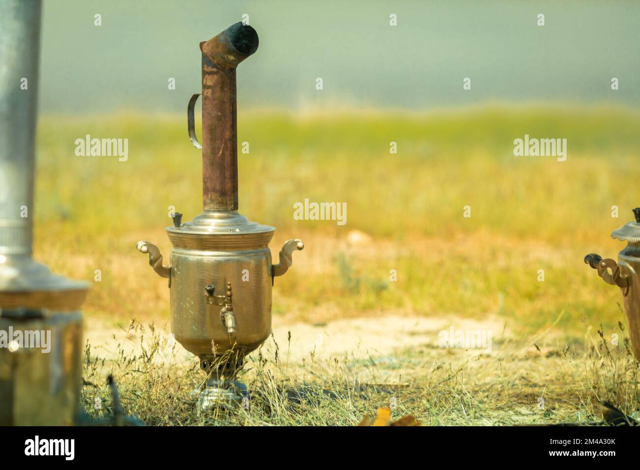 Field kitchen on a trip, water is boiled in a samovar for tea in nature ...