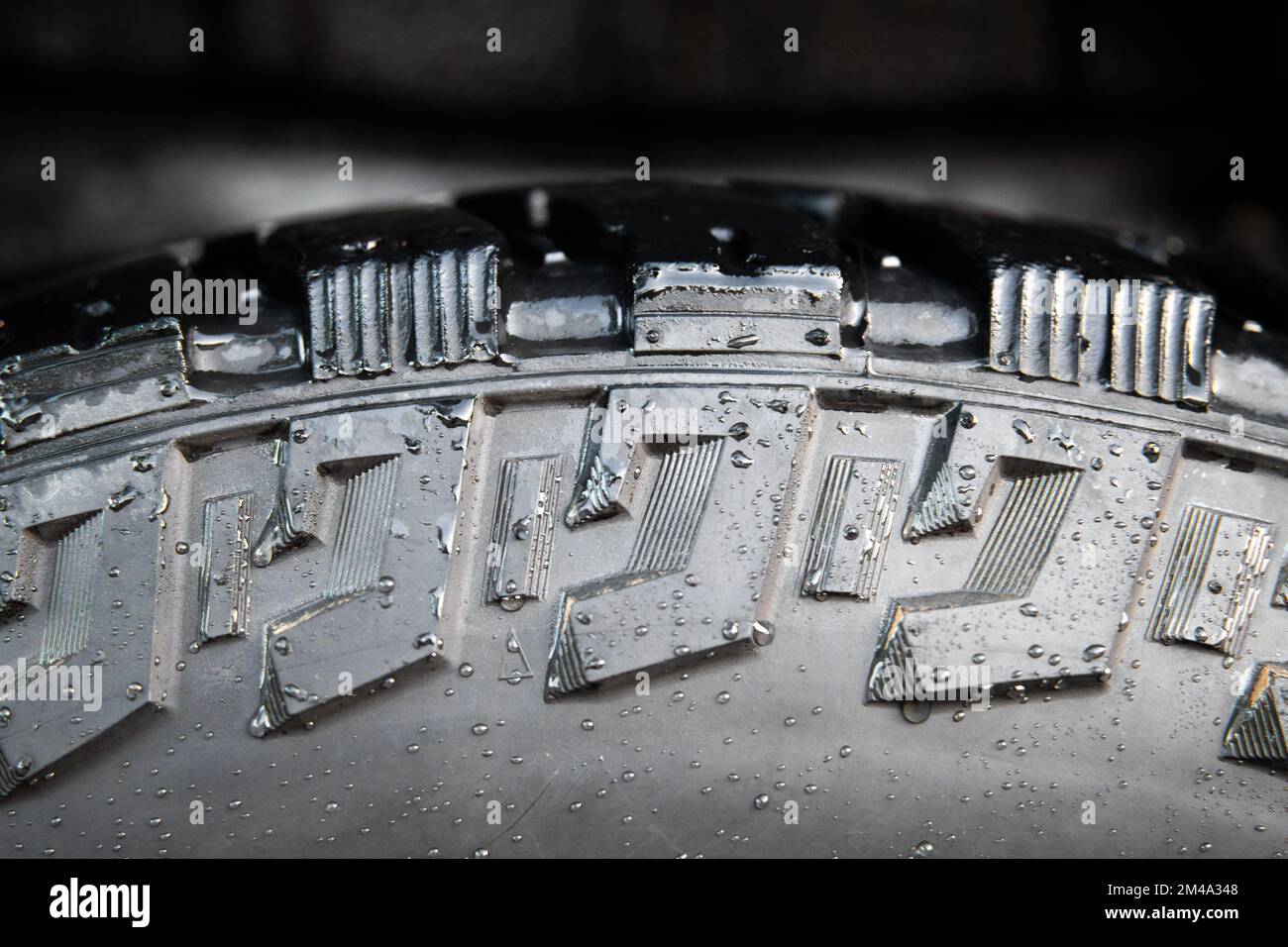 Close-up of black off-road tire tread pattern background side view ...