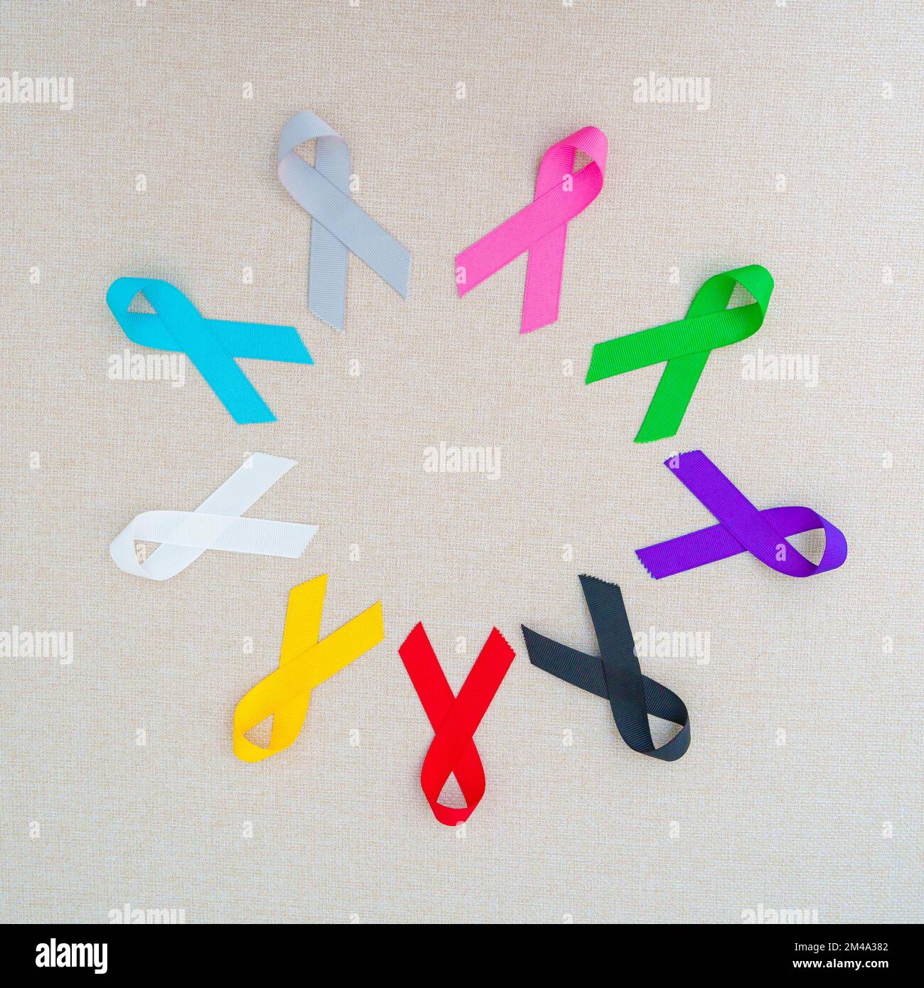 World cancer day, February 4. Colorful ribbons for supporting people ...