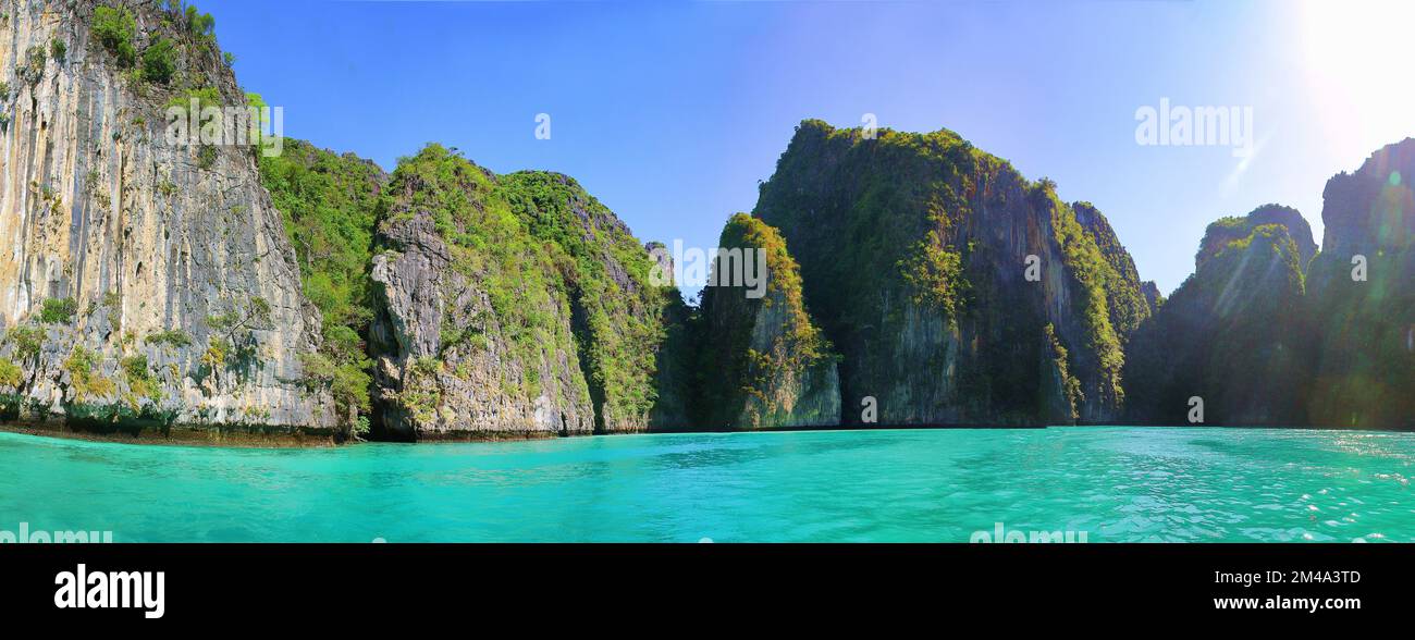 A panoramic scene of green rocky cliffs of Koh Phi Phi in Andaman Sea ...