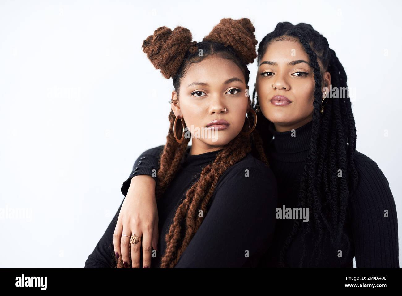 Bring out each others beauty. Studio shot of two beautiful young women ...