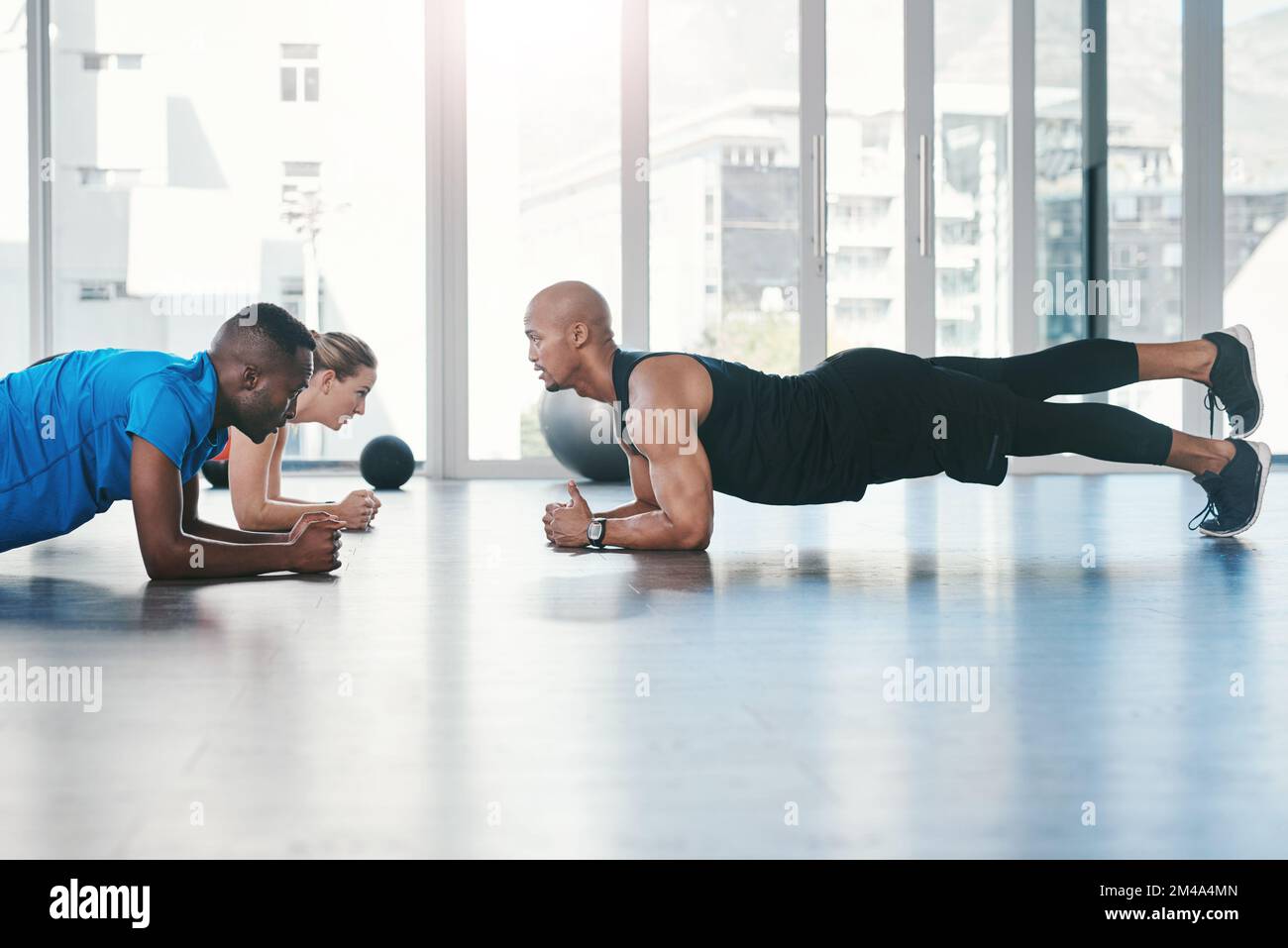 Getting them in good shape. people working out in the gym Stock Photo ...