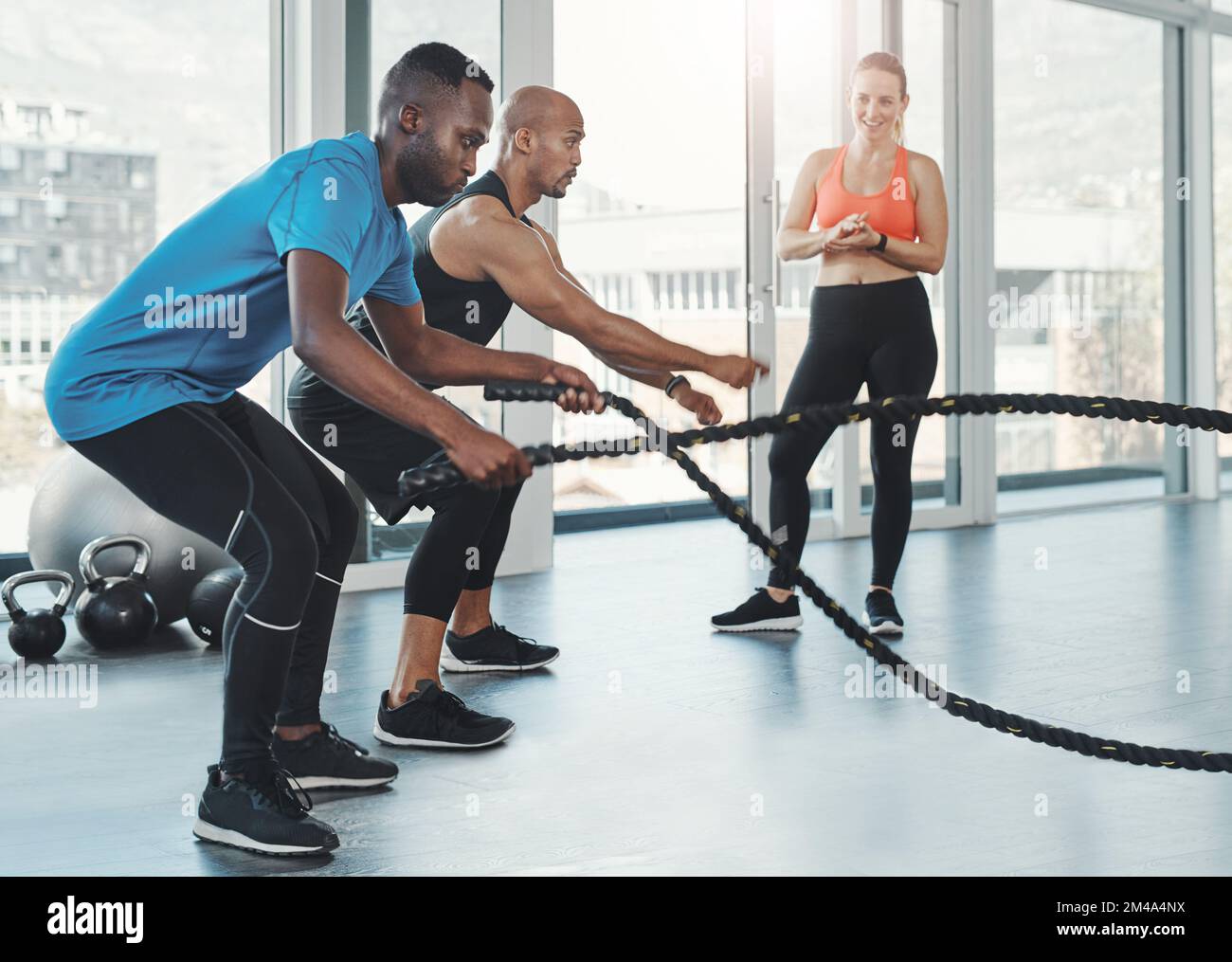 Determined to reach his target. people working out in the gym Stock ...