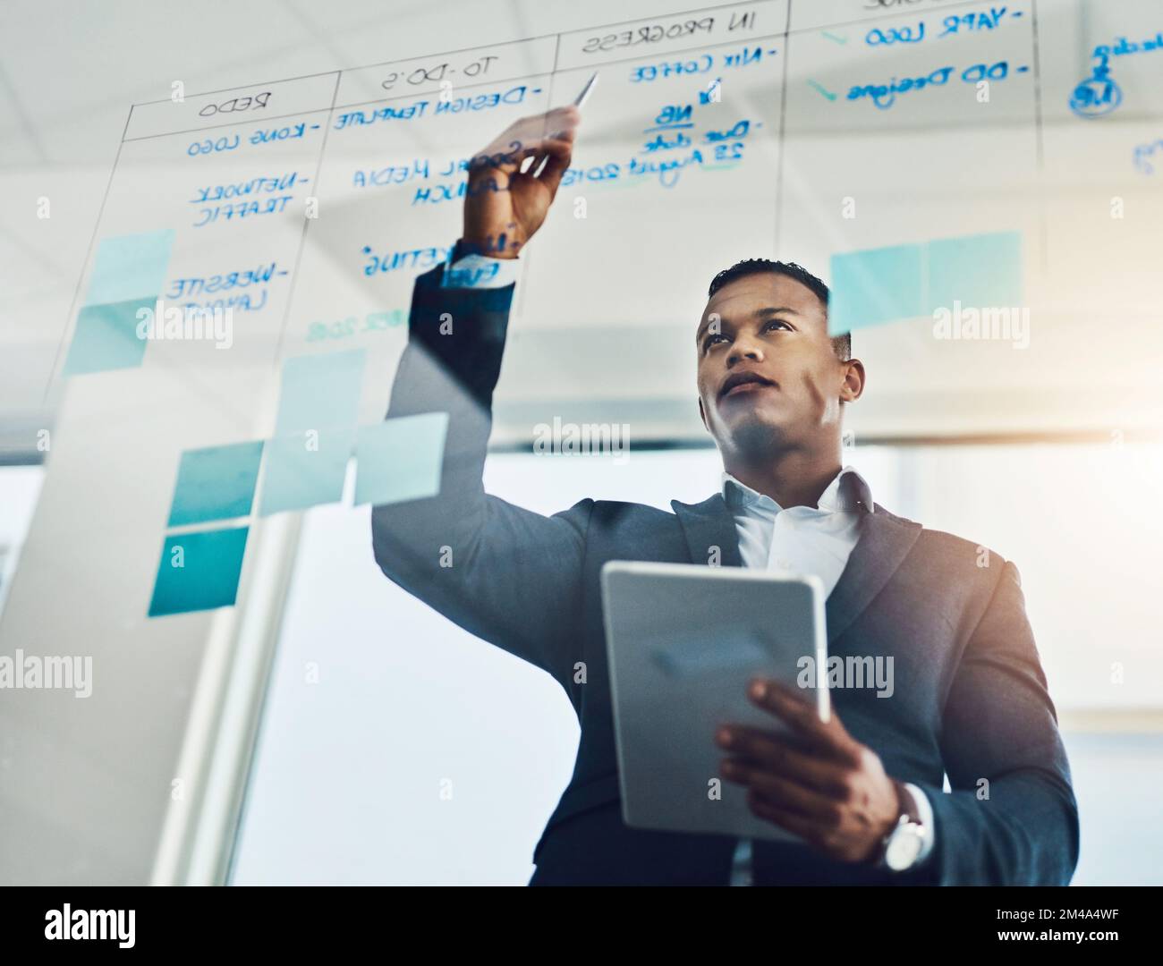 Its time to elevate those ideas. a young businessman using a digital ...