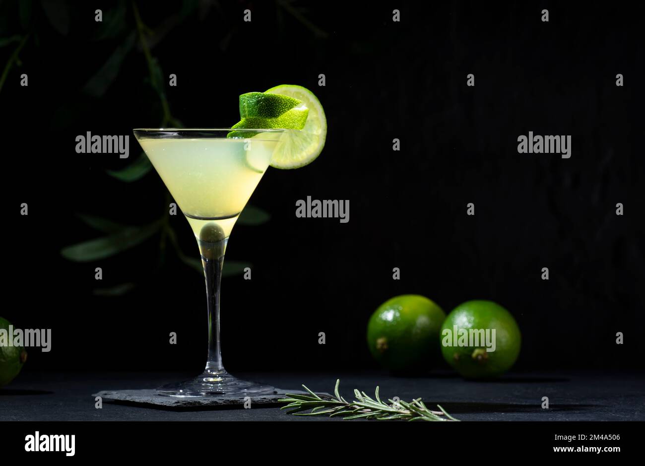 Gimlet alcoholic cocktail with dry gin, liqueur, lime juice and ice in ...