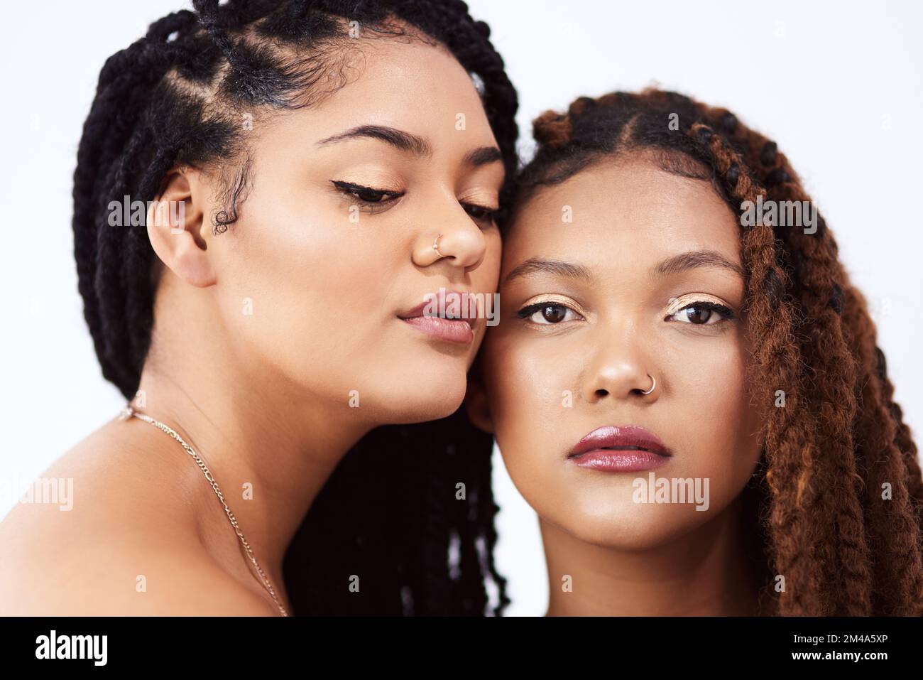Embrace your natural beauty. Studio shot of two beautiful young women ...