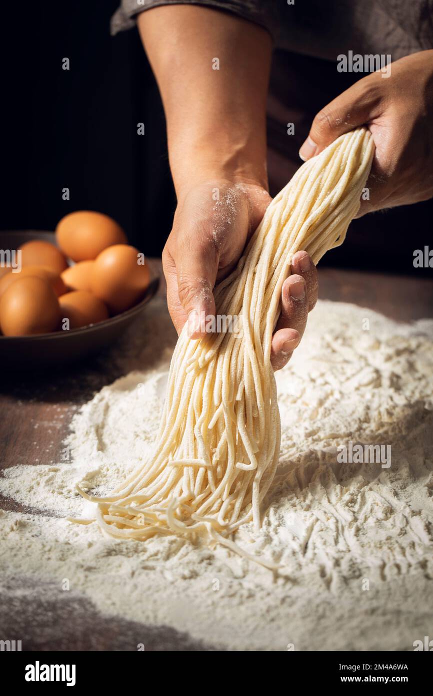 Hand making noodles chinese hi-res stock photography and images - Alamy