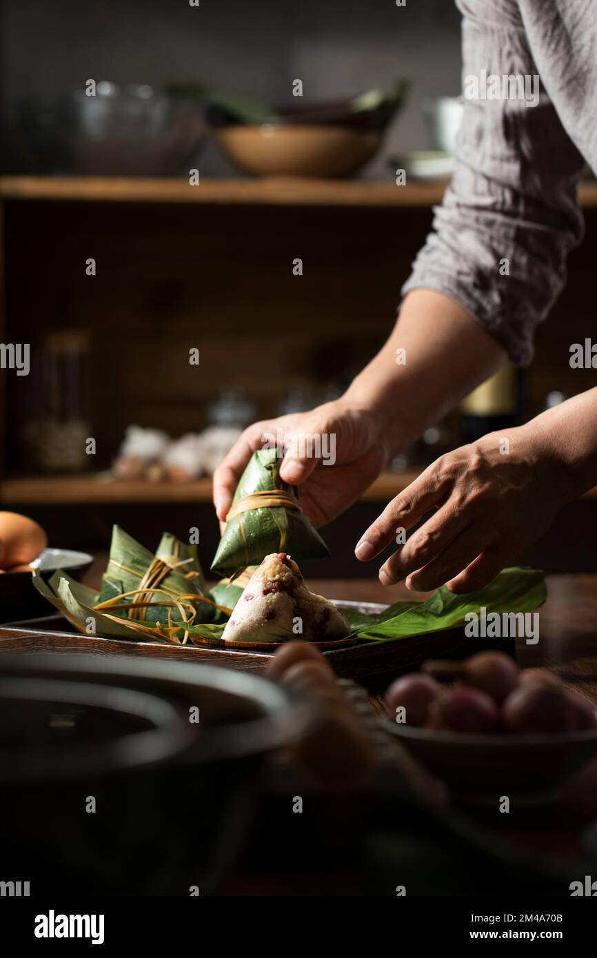 Making Zongzi for Duanwu festival Stock Photo - Alamy
