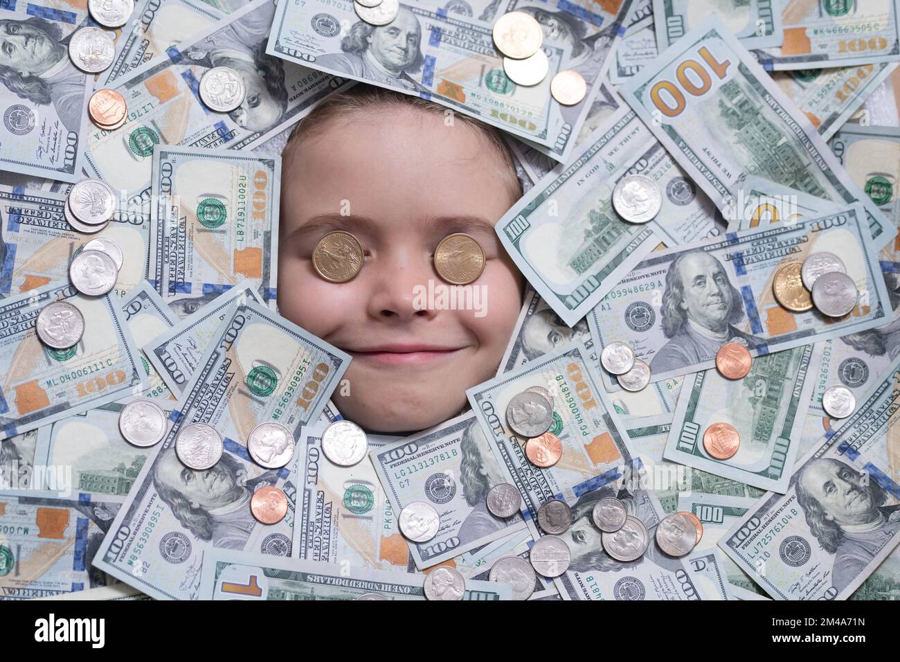 Kids how to be rich. Child with dollar bills near face. Financial independence and ability to earn a lot of money Stock Photo Alamy