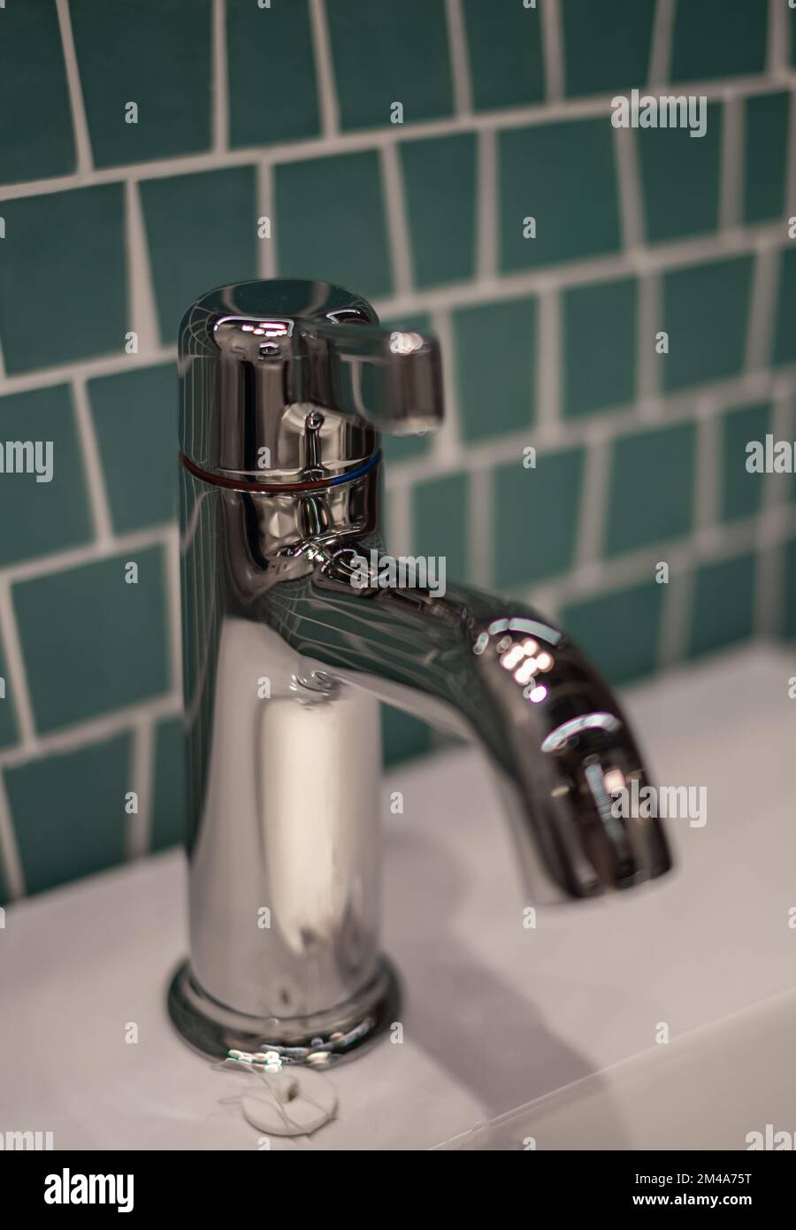 Stainless steel faucet in the bathroom. Water Tap. Close up water ...