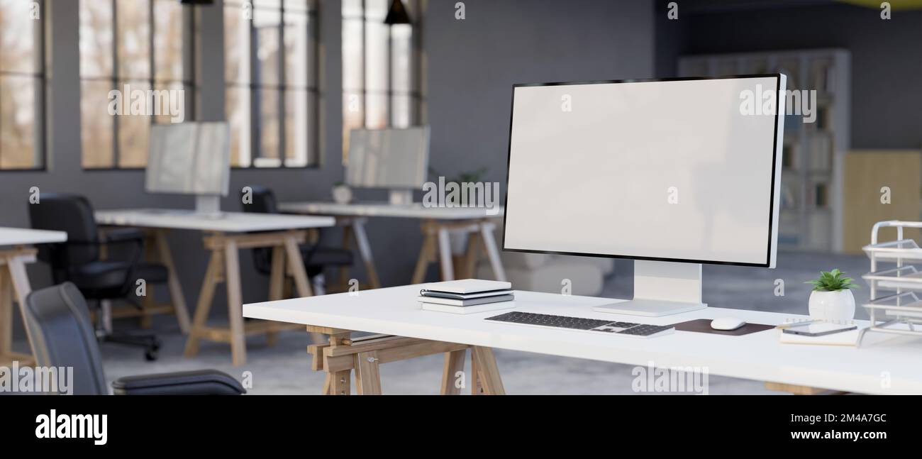Blank screen of a computer mockup with office supplies on a desk in ...