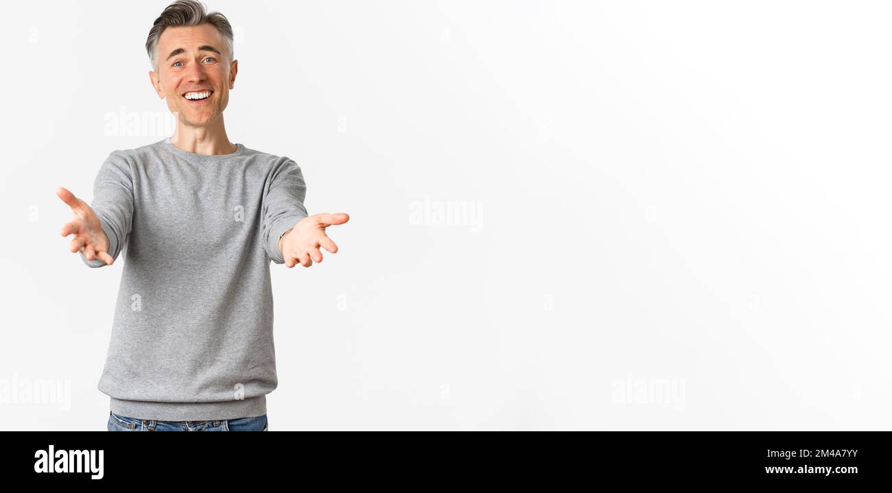 Image of happy and pleased middle-aged man with gray hair, reaching ...