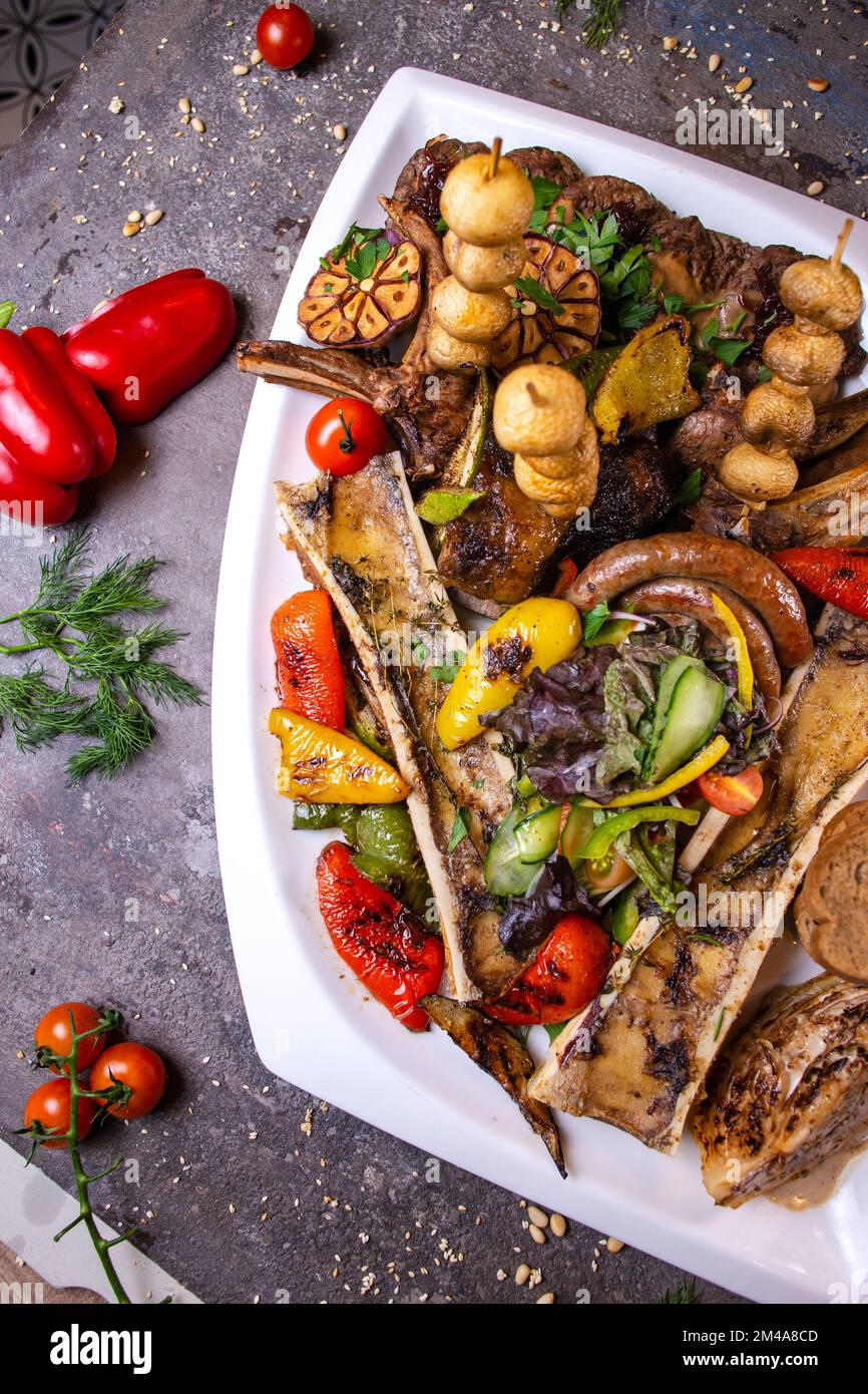 A set of different beef meat dishes on a white plate Stock Photo - Alamy