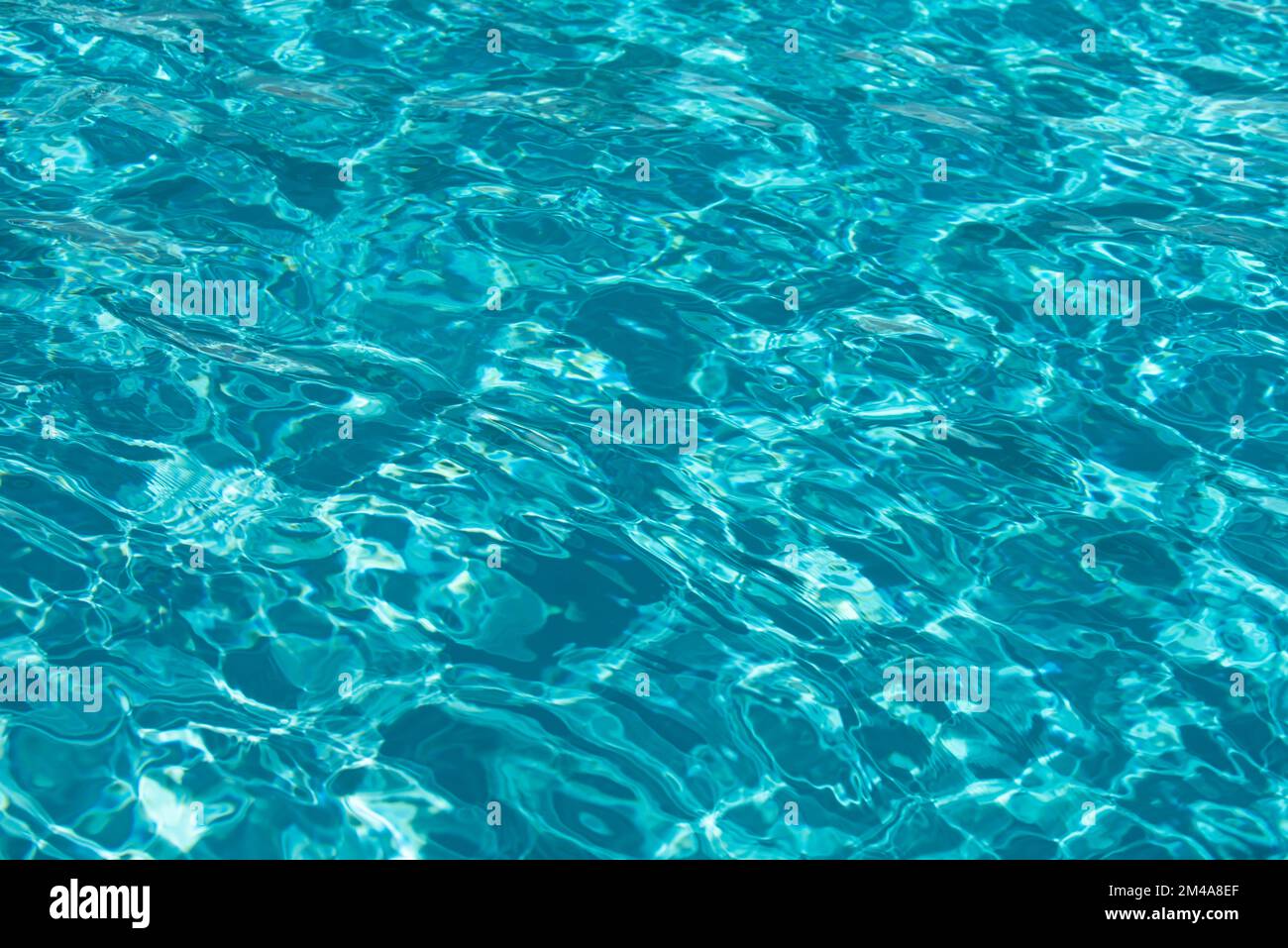 Background of blue water in swimming pool with sun reflection, ripple ...