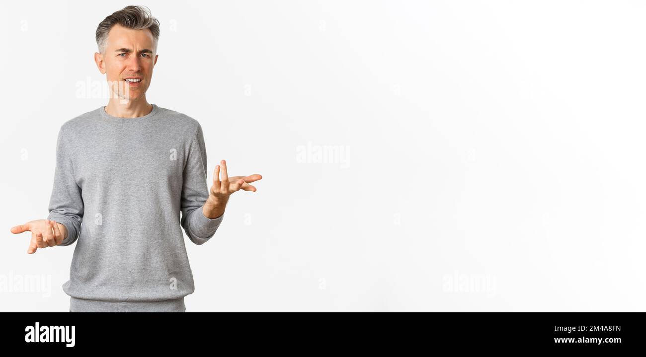 Portrait of confused and disappointed middle-aged man arguing, cant ...