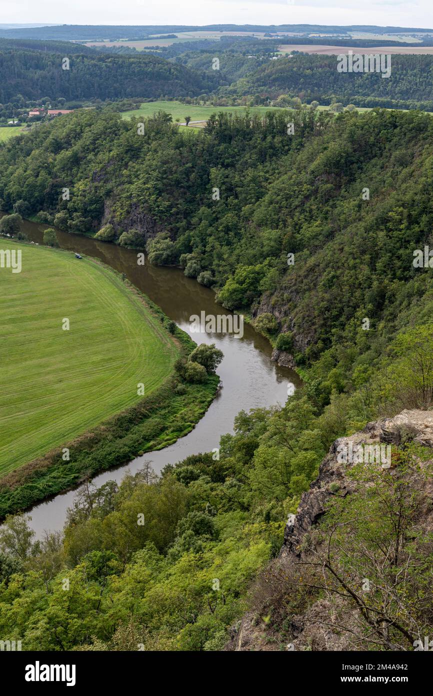 A vertical view of the Berounka river in the greenery of Havlova Skala ...