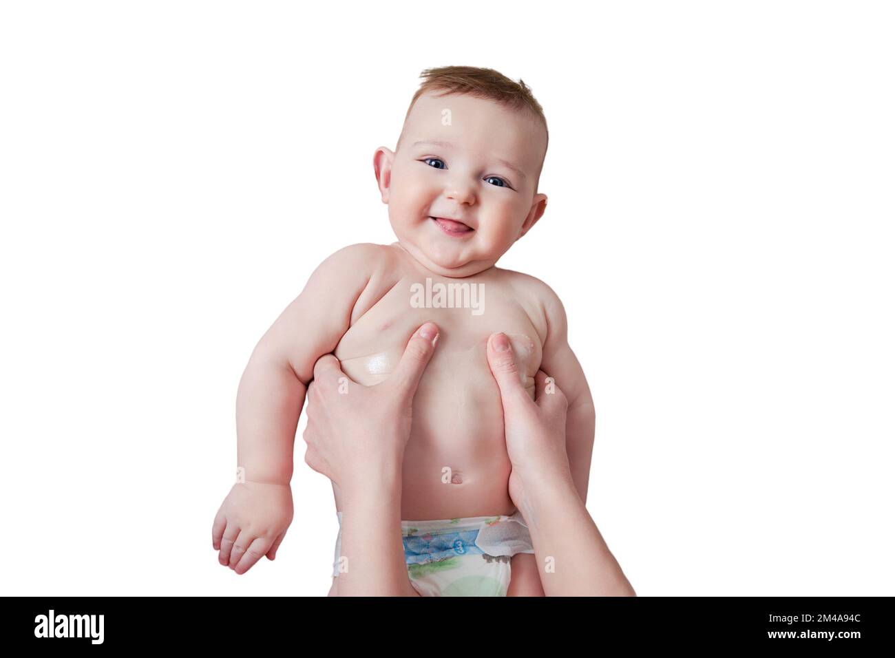Mother hands are smearing cream on a happy infant baby, isolated on a ...