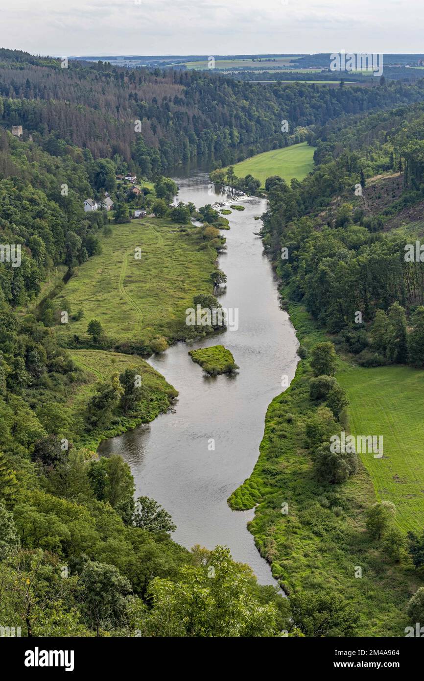 A vertical aerial view of the Berounka river in the greenery of Havlova ...