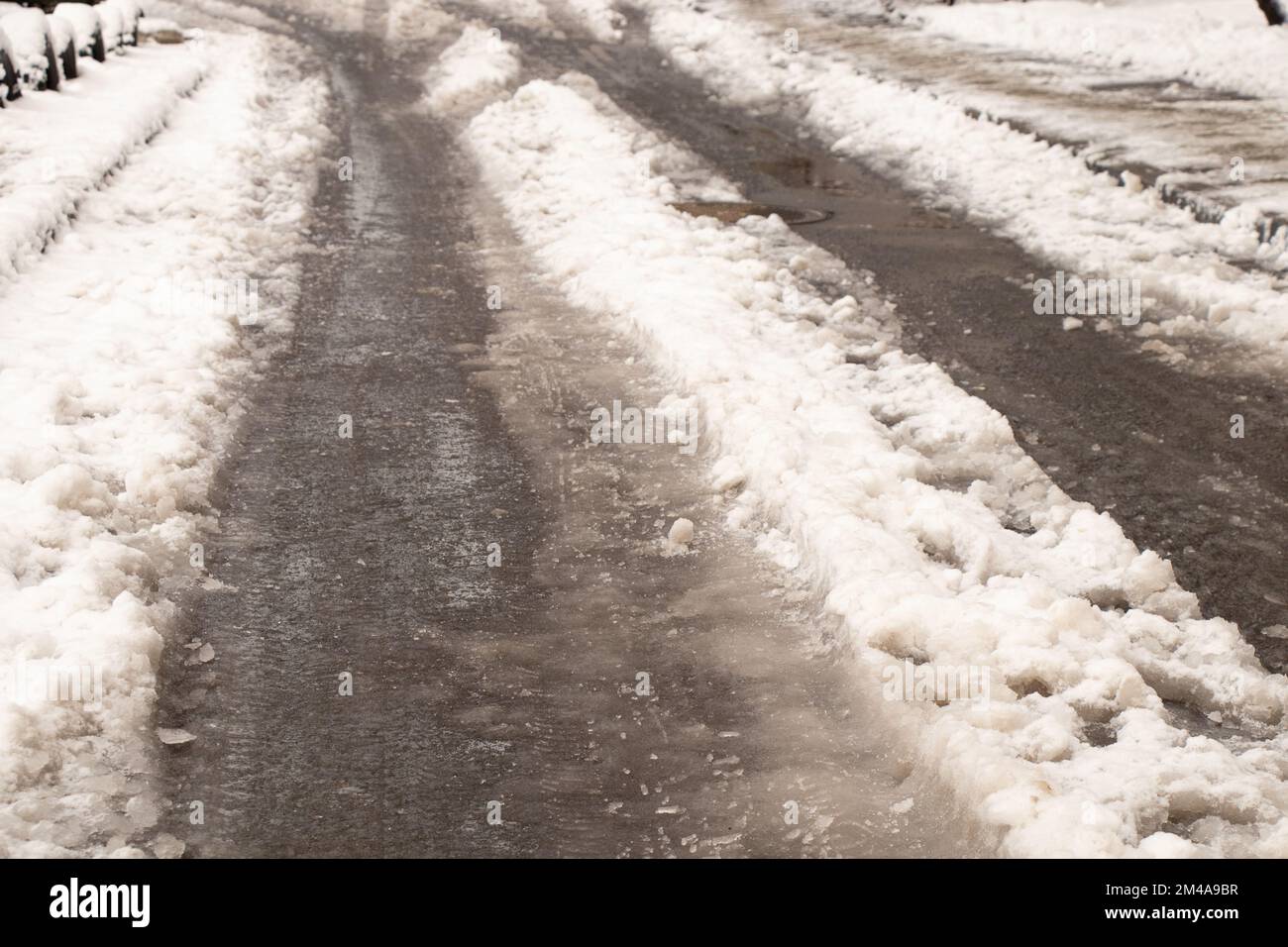 frozen snow from ice on a city street in winter in Ukraine Stock Photo ...