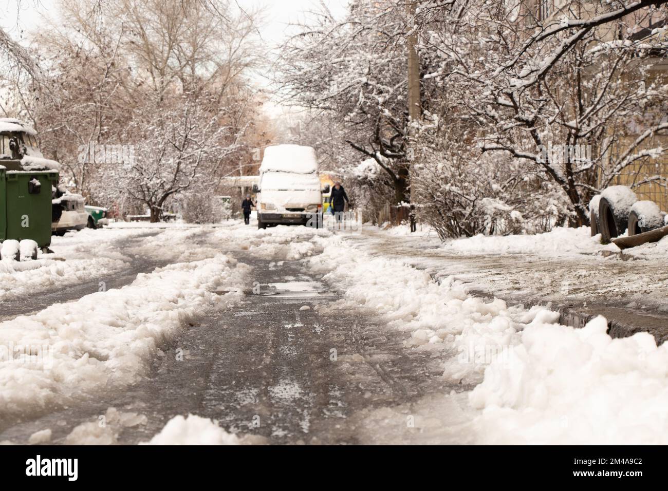 frozen snow from ice on a city street in winter in Ukraine Stock Photo ...