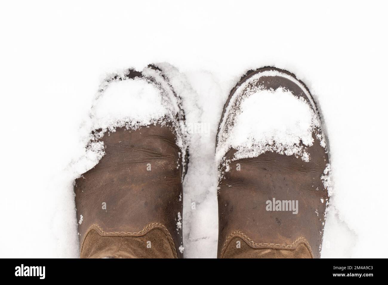women's boots in the snow top view Stock Photo - Alamy