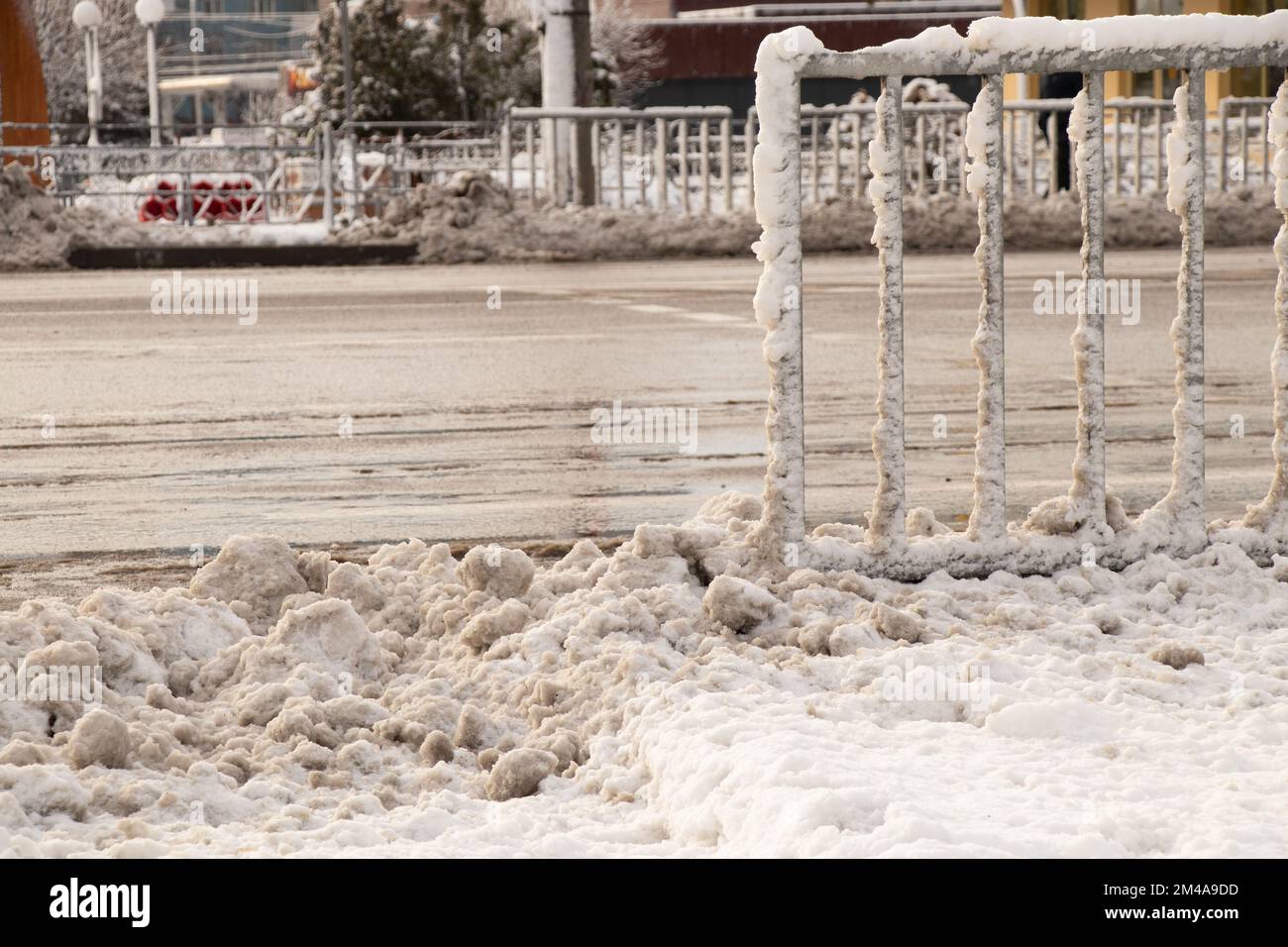 frozen snow from ice on a city street in winter in Ukraine Stock Photo ...