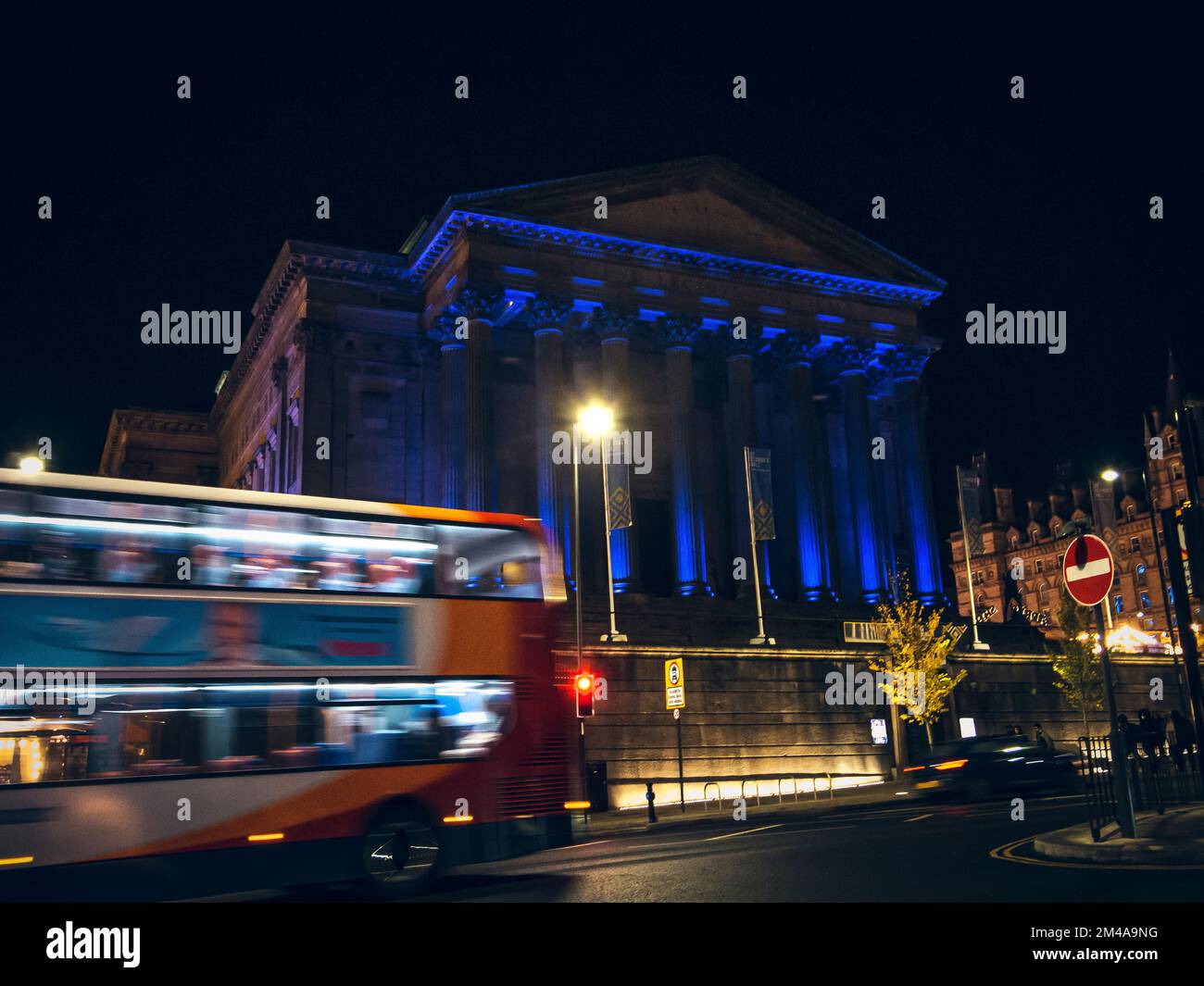 Buses moving at night in Liverpool Stock Photo - Alamy