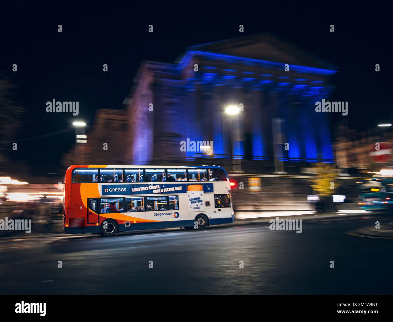 Buses moving at night in Liverpool Stock Photo - Alamy